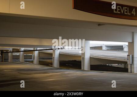 Empty parking garage, ramps to multiple levels, sloped surfaces, mix of ...