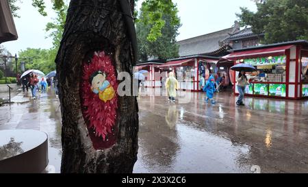 XI'AN, CHINA - APRIL 29, 2024 - A scarred tree draws a cartoon drawing ...
