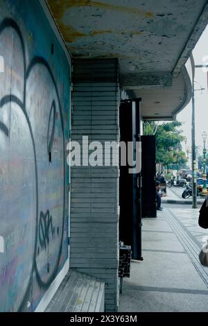 Closed shops on a quiet side street with mural on it Stock Photo - Alamy