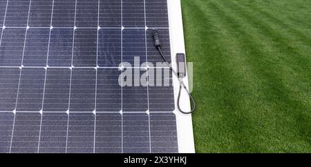 Thin flexible mobile solar panel with cable for connection Stock Photo ...