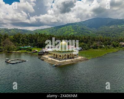 Lake Lanao with deep blue water and tropical mountain with green forest ...