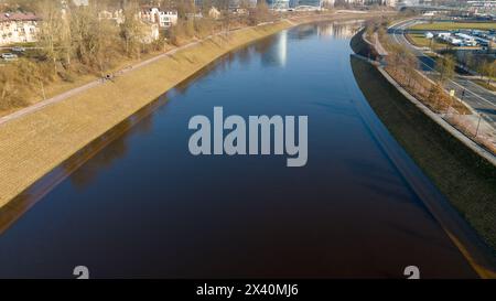 Drone photography of flooded riverside bank in a city during spring ...