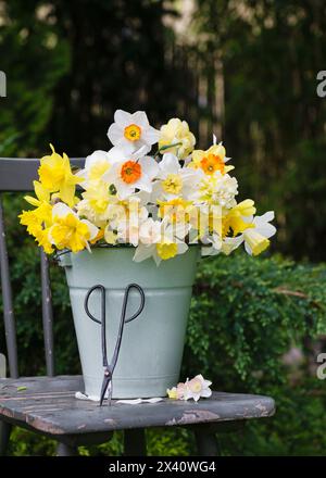 Colorful bouquet of different fresh flowers in the hands of florist ...