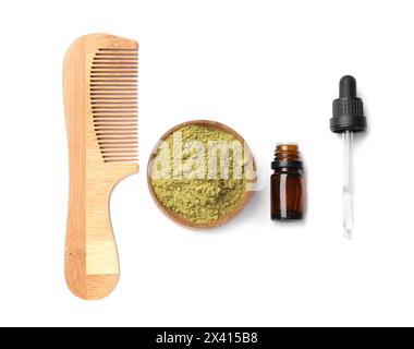 Henna powder in bowl, dropper and comb isolated on white, top view ...
