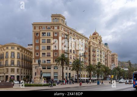 Historical building in Malaga old town with tourists walking the ...