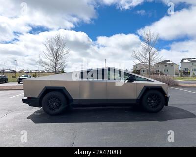Side View of a Tesla Cybertruck in a Spacious Outdoor Parking Area ...