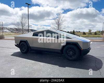 Side View of a Tesla Cybertruck in a Spacious Outdoor Parking Area ...