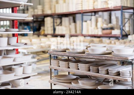 Ceramic dishes blanks on factory rack Stock Photo - Alamy