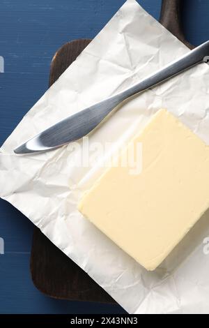 Block of butter with butter knife in a open pack. Buttering bread Stock ...