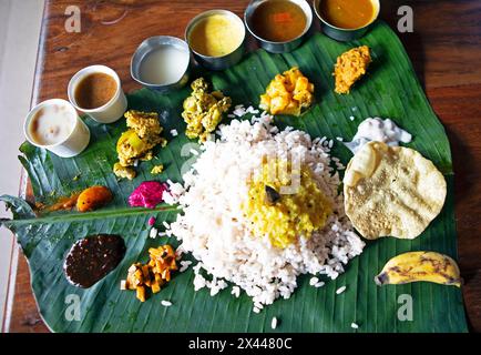 Sadya or variety of traditional vegetarian dishes served for lunch on a ...