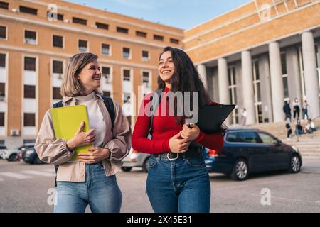 two student girls leaving class Stock Photo - Alamy