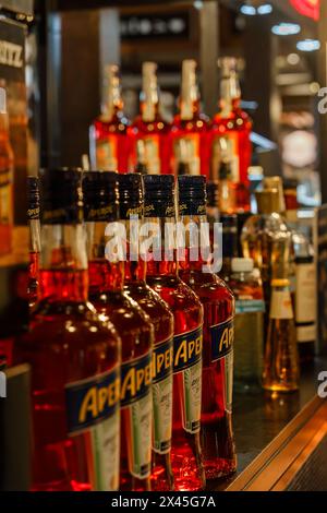 Liquor bottles lined up on a roof top bar overlooking the fourth of ...