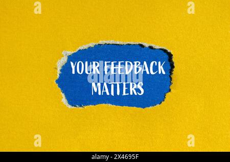 Your feedback matters written on ripped yellow paper with blue ...
