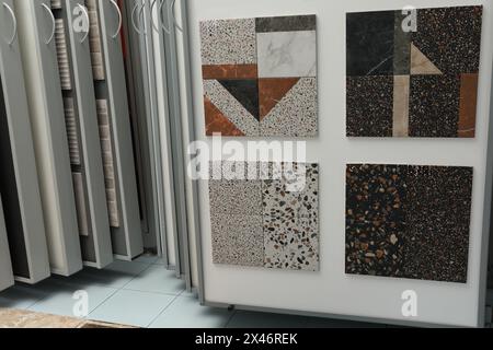 Samples of tiles with different patterns on display in store Stock ...