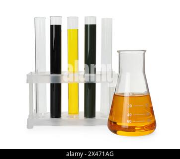 Laboratory glassware with yellow oily liquid on grey background Stock ...
