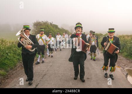 Long Man Morris Dancers perform below the Long Man of Wilmington, East ...