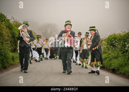 Long Man Morris Dancers perform below the Long Man of Wilmington, East ...