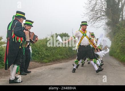 Long Man Morris Dancers perform below the Long Man of Wilmington, East ...
