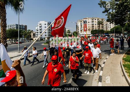 Limassol, Cyprus. 01st May, 2024. The marching people are reflected in ...