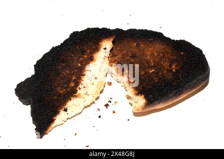 A Very Burnt Bread Roll Torn or Cut in Half Toast Close Up Texture ...