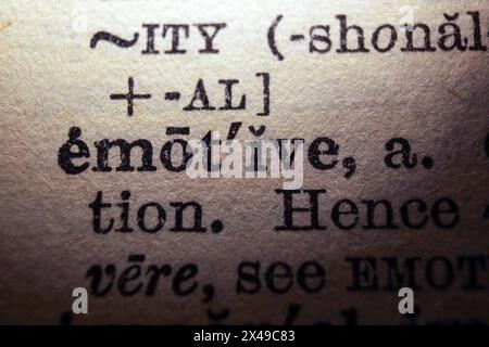 Word emotive on dictionary page, macro close-up Stock Photo - Alamy