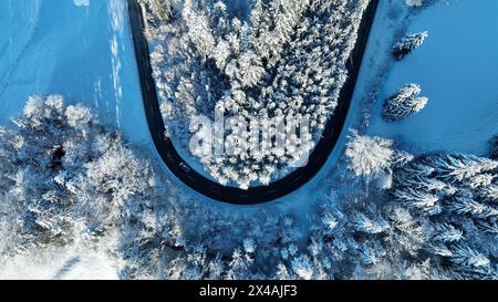 Drone photo of a sharp bend in the road with traffic in winter Stock ...