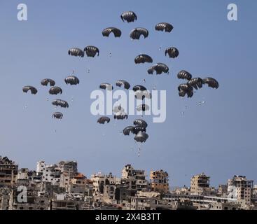 Gaza. 30th Apr, 2024. Humanitarian aid dropped by a plane is seen over ...