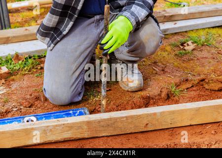 Production of formwork for concrete base foundation house with use ...