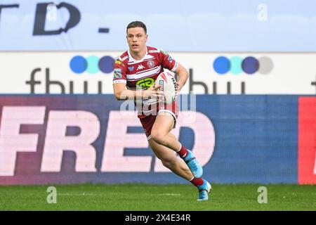 Jai Field #1 of Wigan Warriors makes a break during the Betfred Super ...