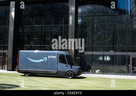 Seattle, USA. 22nd Apr 2024. Amazon Rivian EV delivery vehicle at the ...
