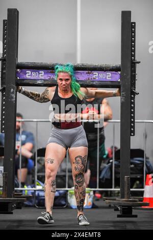 Australian strongwoman Kimmy Anne is seen performing Yoke walk at 2024 ...