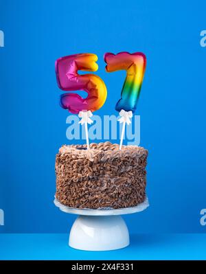 Multicolored balloon for number 57 celebration. Happy birthday on white ...
