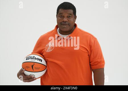 Jevone Moore aka Orange Man and Mr. Orange poses with a WNBA basketball ...