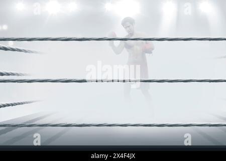 A boxer inside the ring with mist ready to fight for training session ...
