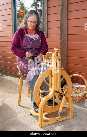traditional wool spinning on a spinning wheel, fashion and design ...