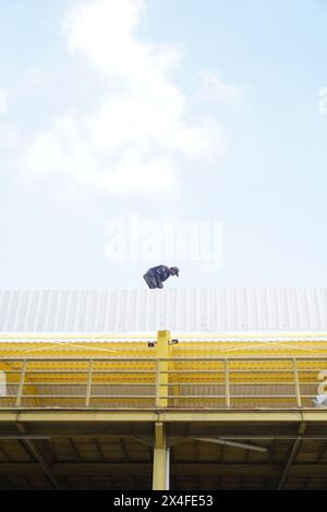 Man on top of tall building in London Stock Photo - Alamy