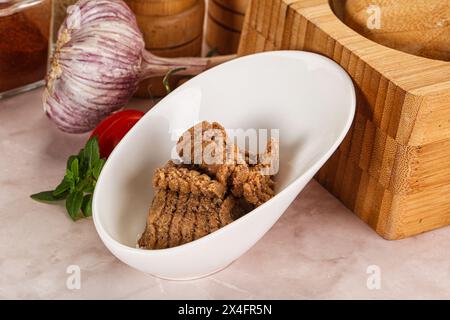 Liver pate in the bowl served basil leaves Stock Photo - Alamy