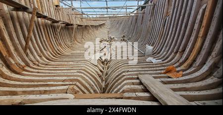 Interior of a giant traditional dhow in the shipbuilding factory of Sur ...