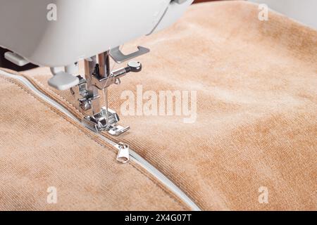 Modern sewing machine special presser foot and zipper with yellow ...