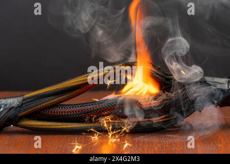 Electrical wiring and wires are lit on a dark background. A short ...