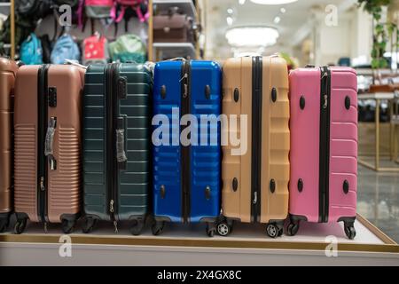 Large selection of colorful suitcases in store. Travel suitcases for ...