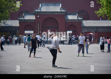 People playing Jianzi, traditional Chinese national sport in which ...