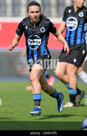 Angel Kerkhove (13) of Brugge pictured fighting for the ball with Luna Vanzeir (30) of ...