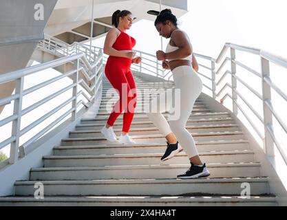 Two female friends with different body types wearing black sportswear ...