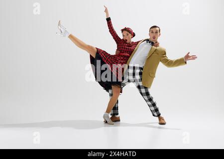 Playful moment captured between a dancing couple, young handsome man ...