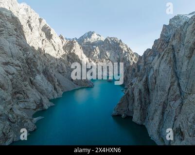 Mountain lake Kol Suu rocky steep mountains, sun star, Kol Suu Lake ...