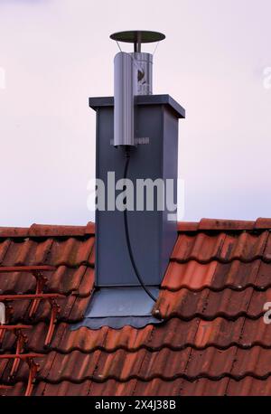 Retrofitted chimney on roof, with dust separator, electrostatic ...