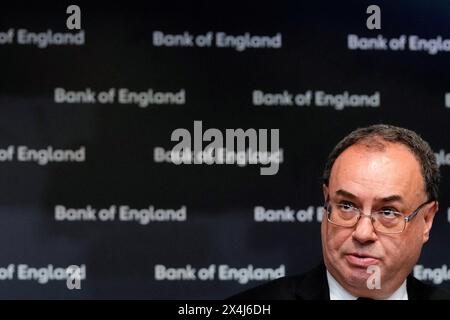 Governor of the Bank of England Andrew Bailey, center, speaks as he ...