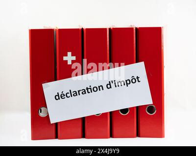 Concept for Swiss tax return. Office folders with Swiss flag symbol and ...