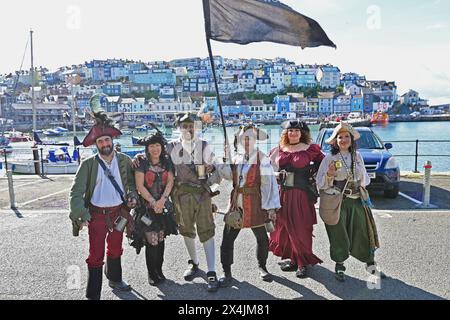 People in Pirate dress are seen flying the flag and getting ready ...